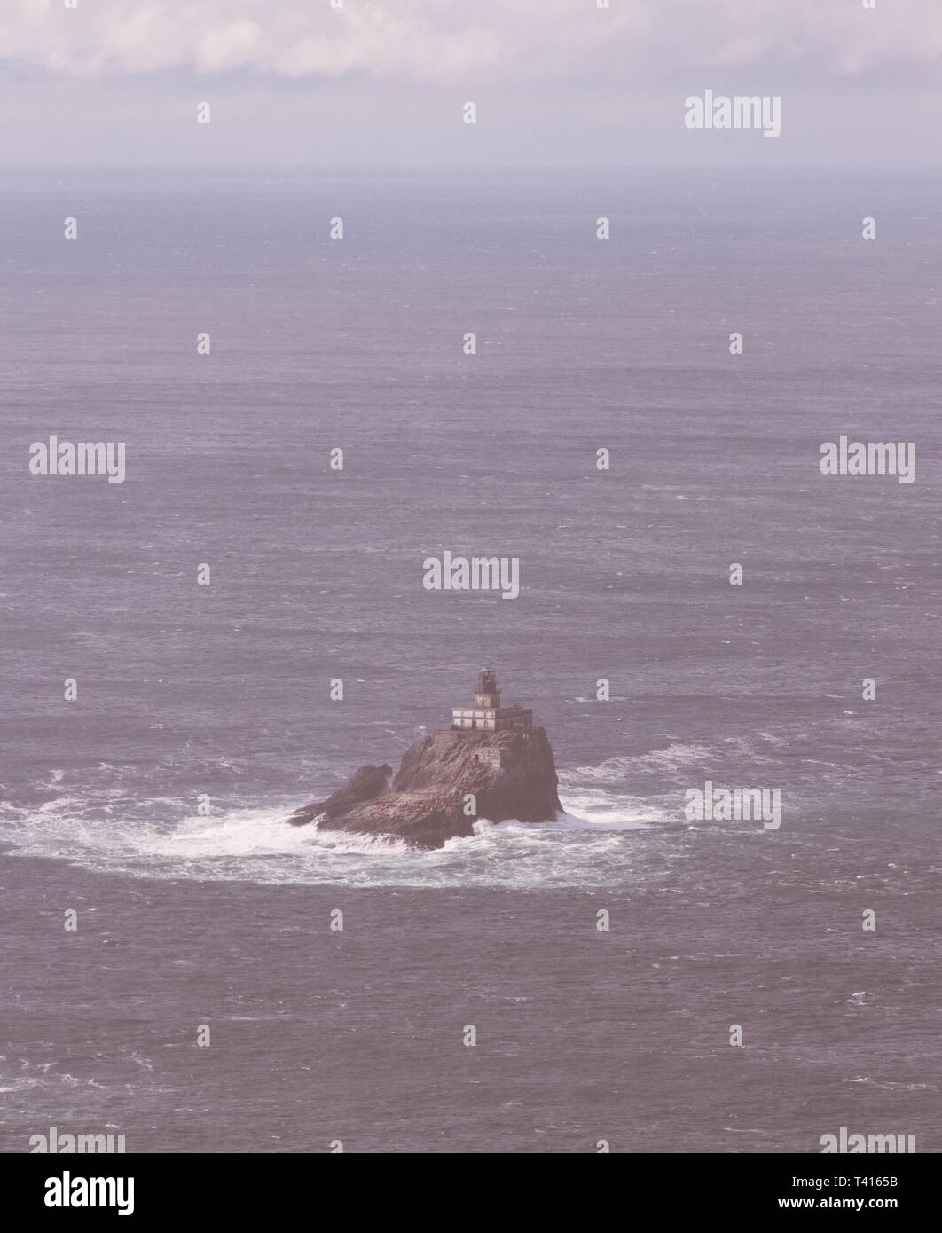 A lighthouse build on a rock Stock Photo - Alamy