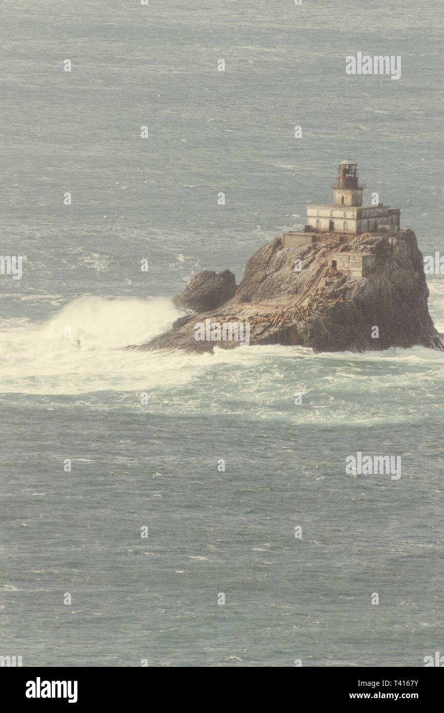 A lighthouse build on a rock Stock Photo - Alamy