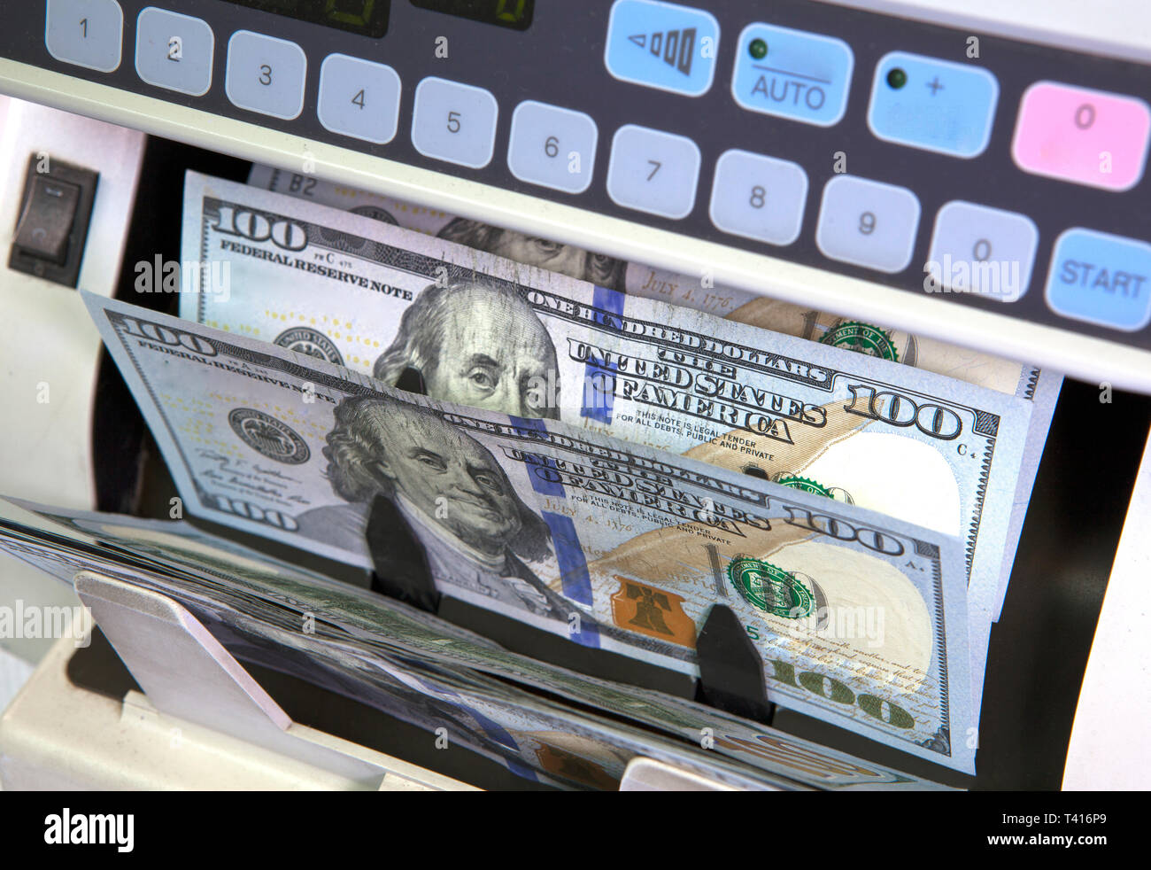 Electronic money counter machine is counting is counting the American ...