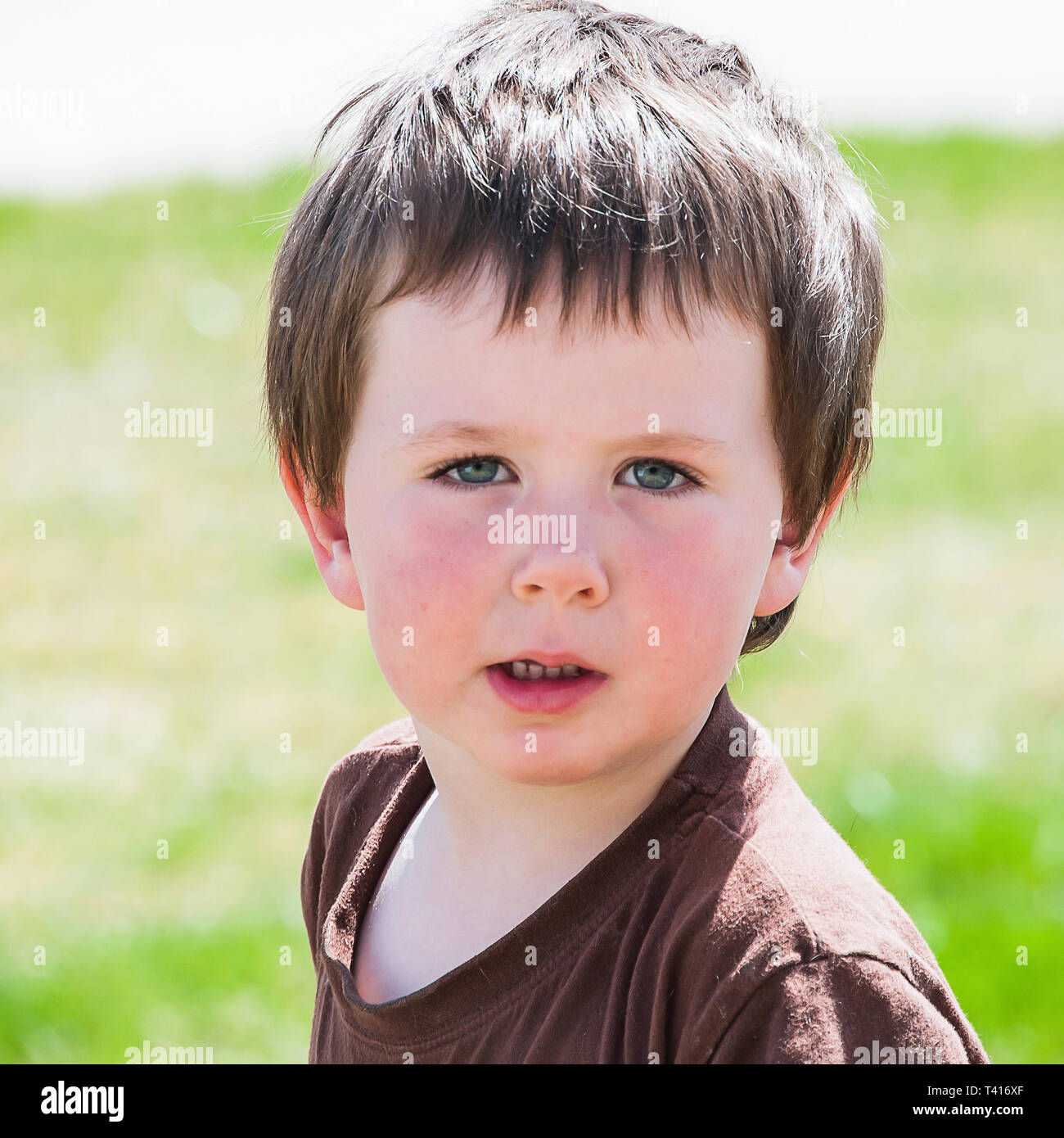 Little four year old boy looking forward with a cute expression Stock ...