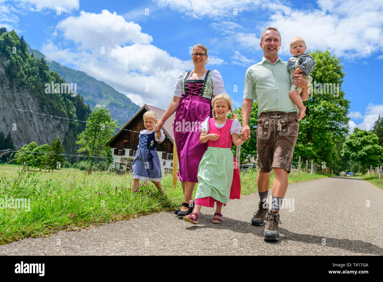 Family excursion in traditional clothing Stock Photo - Alamy