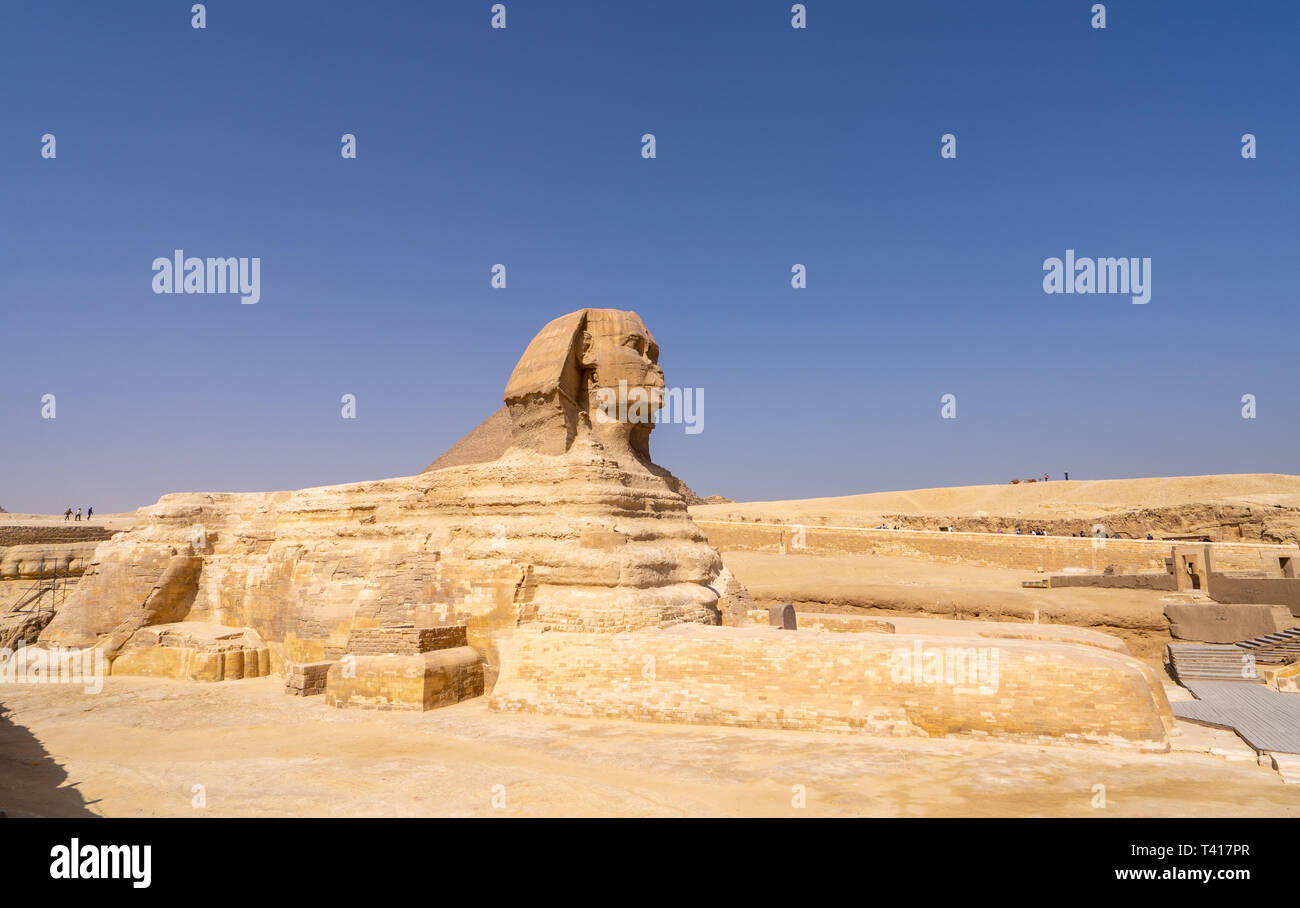 Great Sphinx of Giza, with the Great Pyramid in the background Stock ...