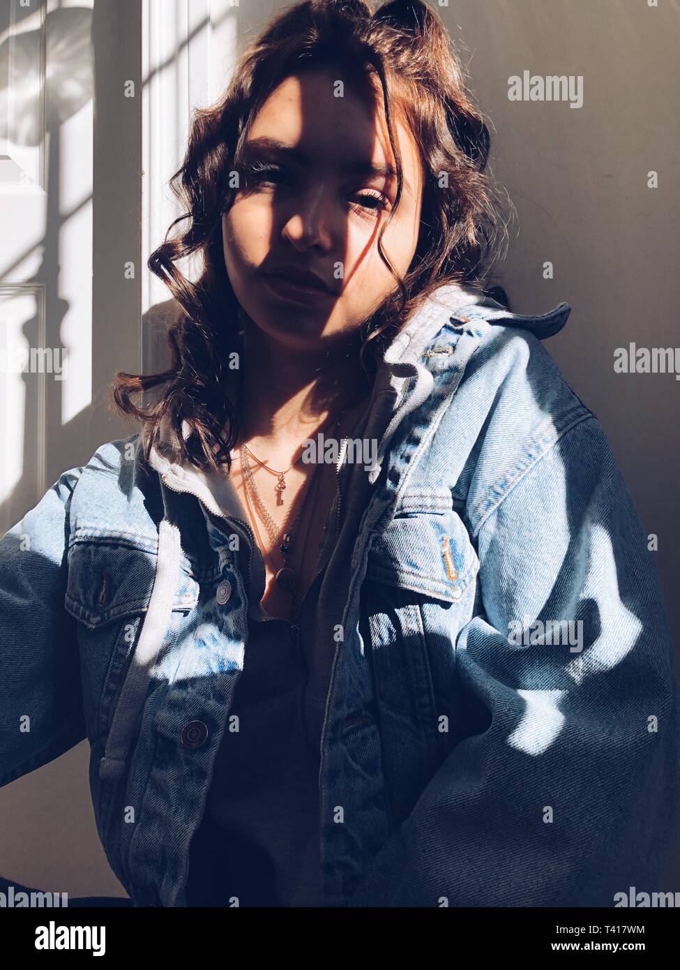 Portrait of a teenage girl with a shadow across her face Stock Photo ...