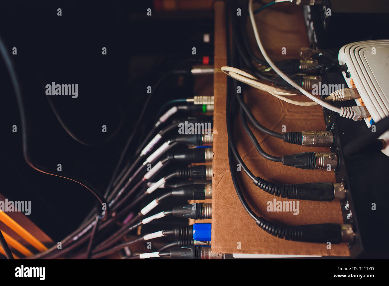 Audio jack cable connected at rear end of mixer at broadcasting,shallow ...