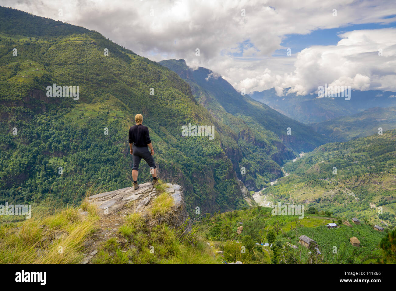 Man standing on top of the hill in Himalayas. Achievement and success ...