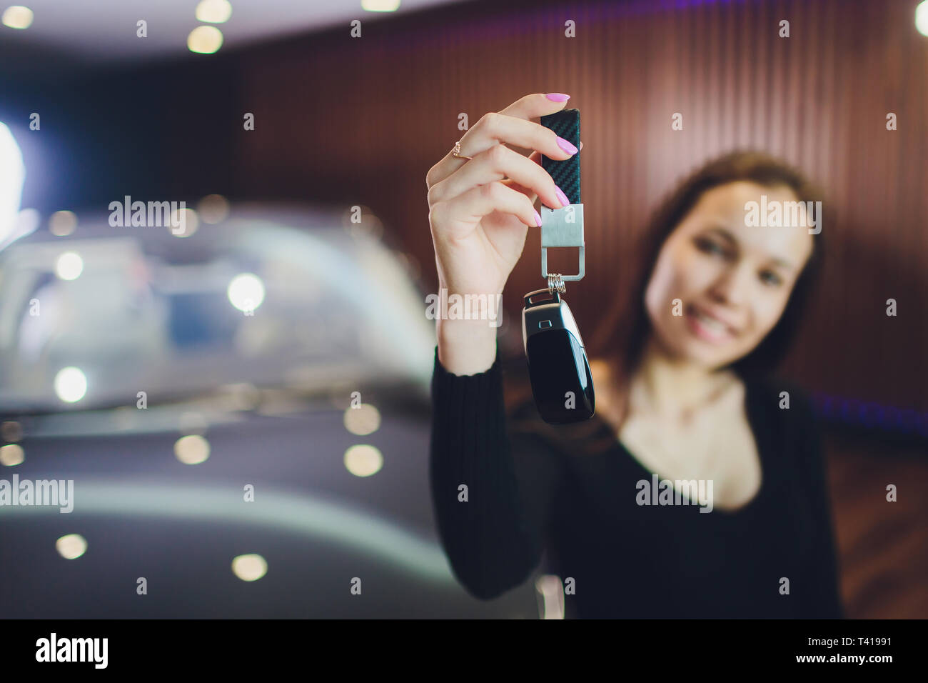 Woman Driver Holding Car Keys. Car Showroom Stock Photo - Alamy