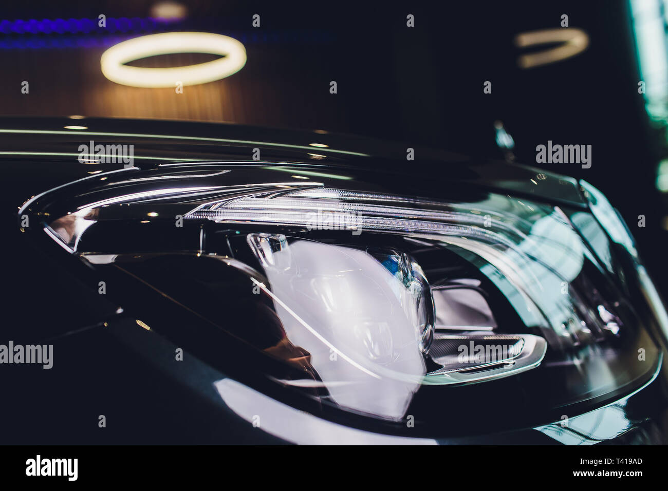 close up headlights front side view , black color car in room Stock ...