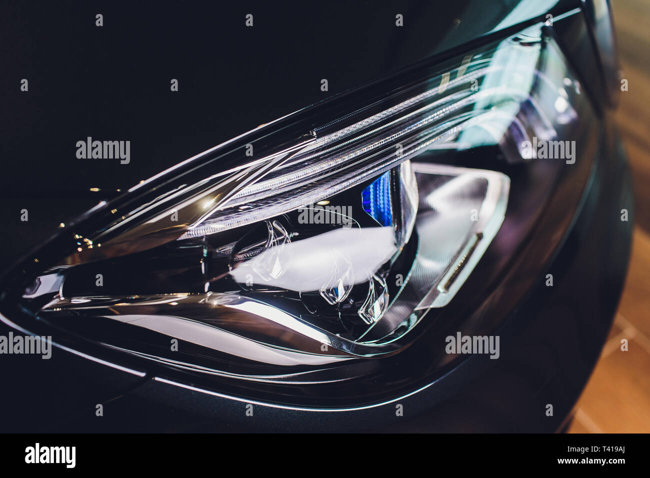 close up headlights front side view , black color car in room Stock ...