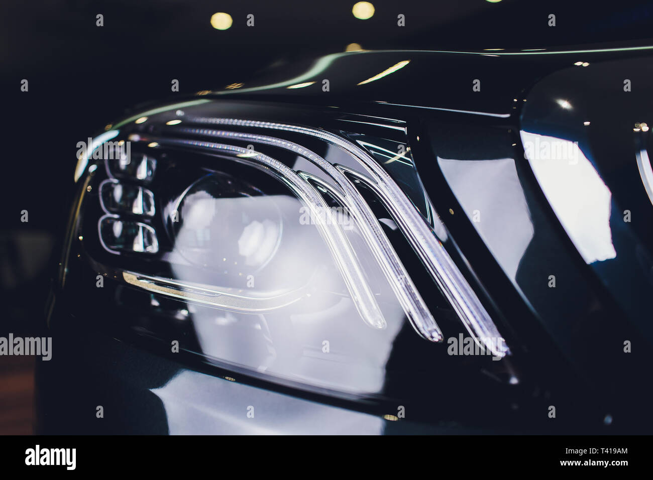 close up headlights front side view , black color car in room Stock ...