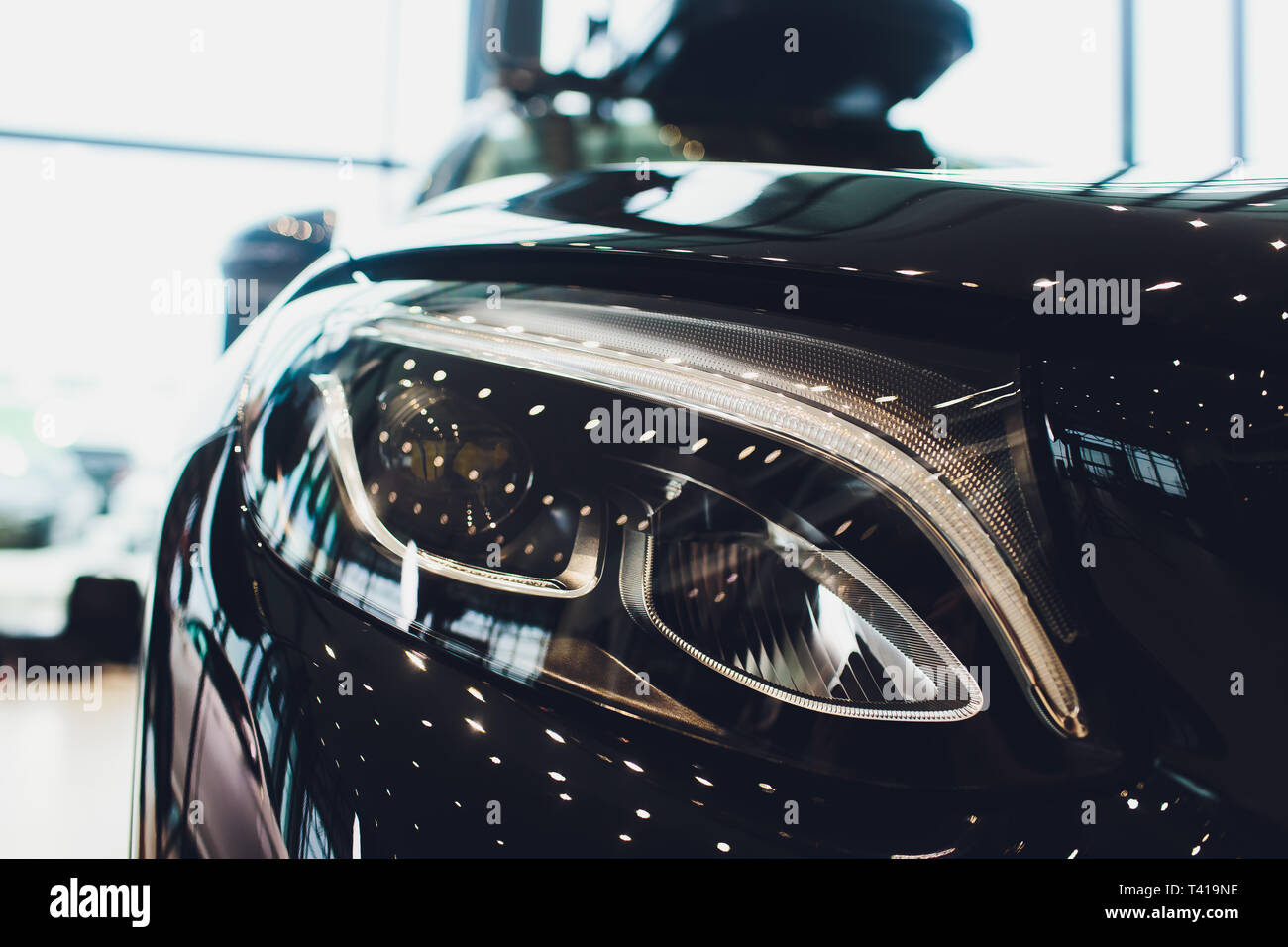 close up headlights front side view , black color car in room Stock ...