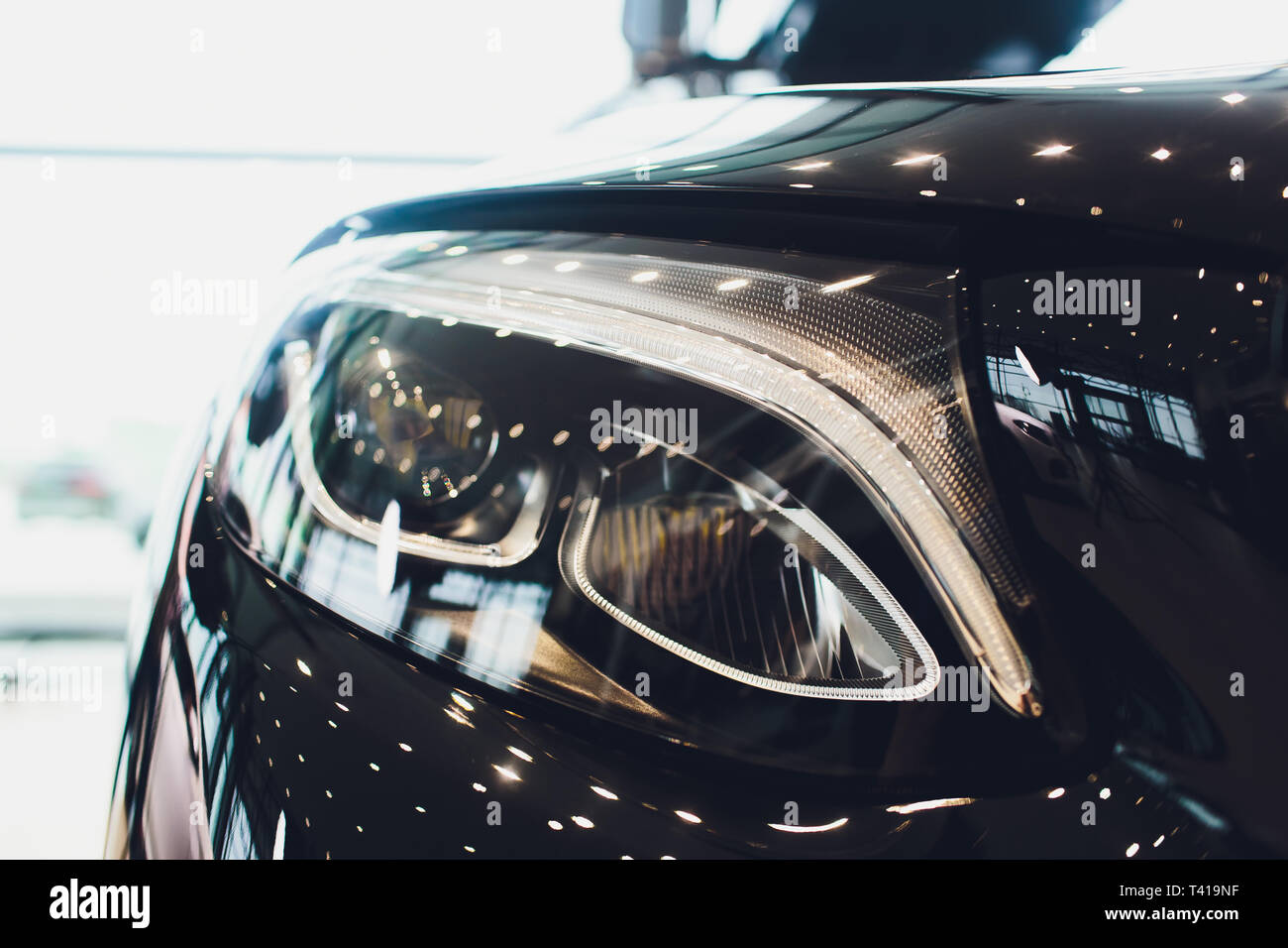 close up headlights front side view , black color car in room Stock ...