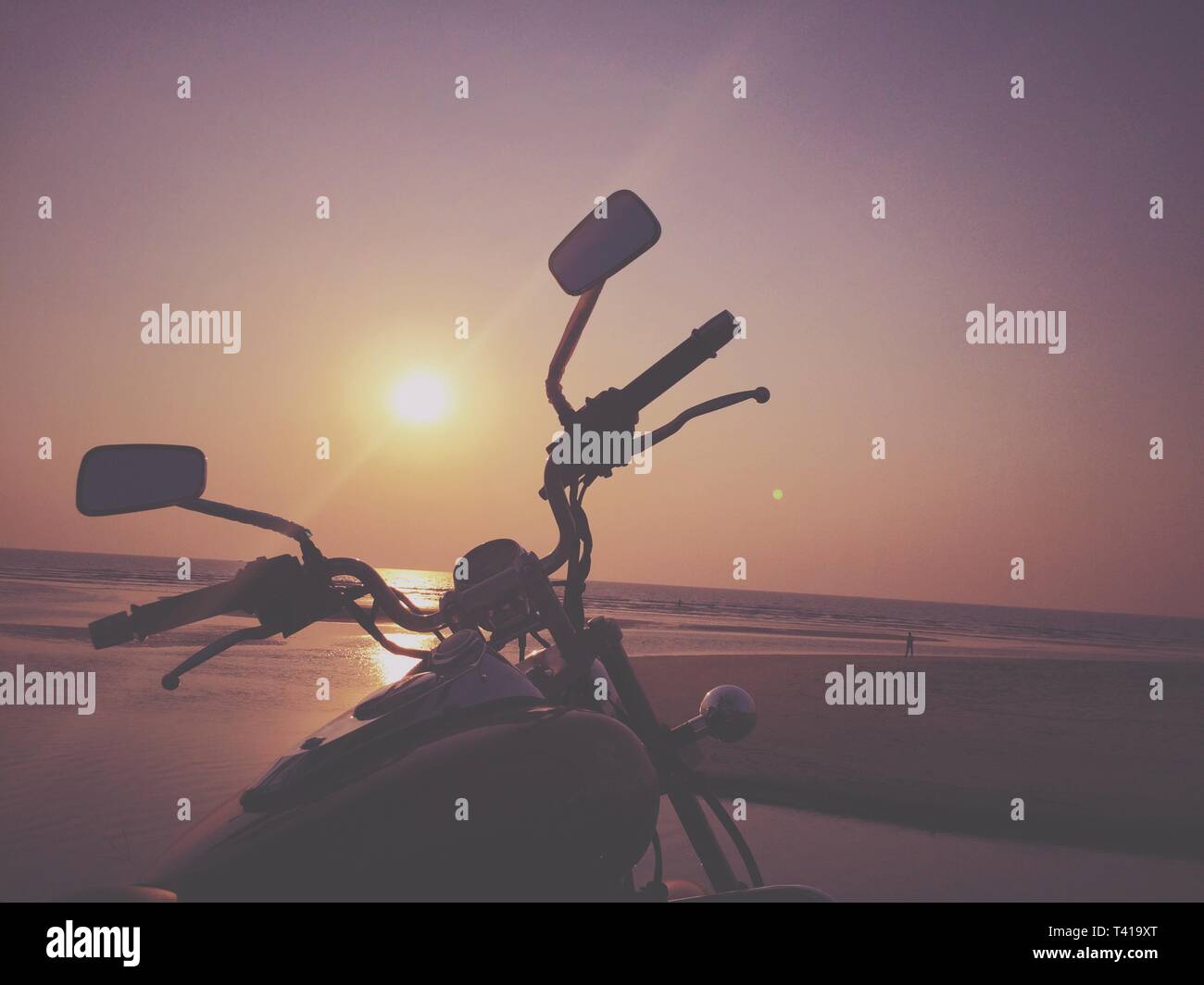 Harley davidson sunset bike motorbike sea sun sky hi-res stock ...