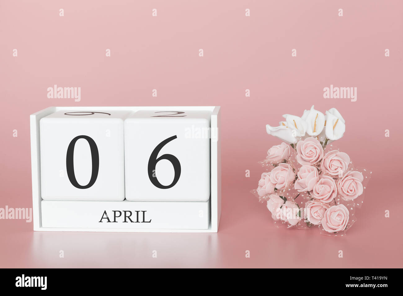 April 06th. Day 6 of month. Calendar cube on modern pink background ...