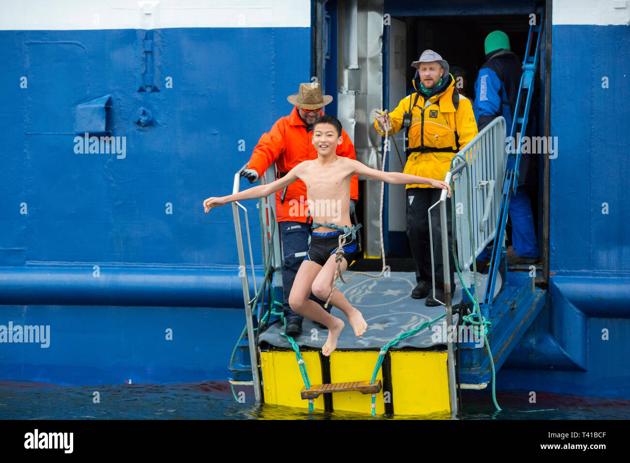 Tourists on an Antarctic cruise ship take part in a polar plunge ...