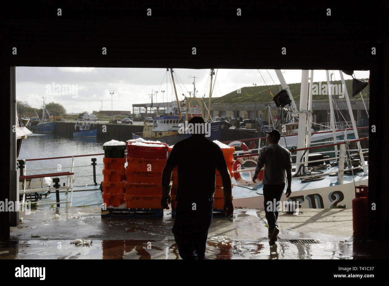 Trawler crew loading nets hi-res stock photography and images - Alamy