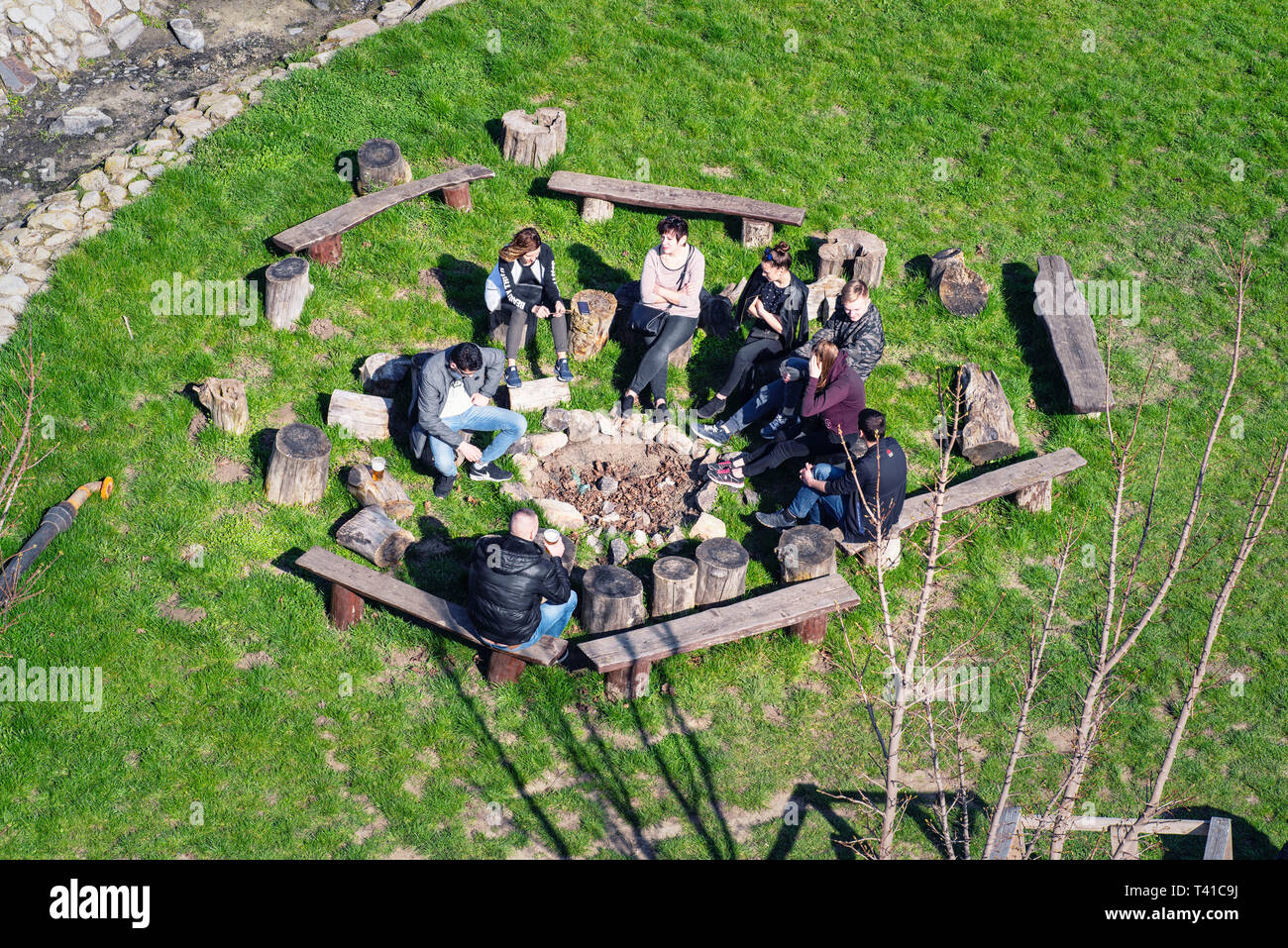 Adult men sitting around campfire hi-res stock photography and images ...