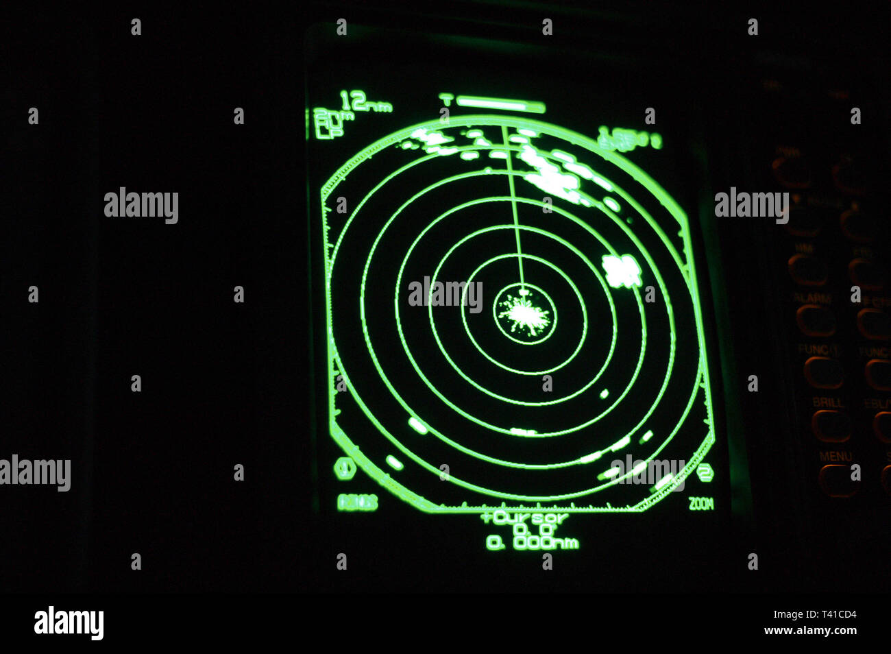 Radar on board fishing trawler in Irish Sea. 4-man crew work on 1 of ...
