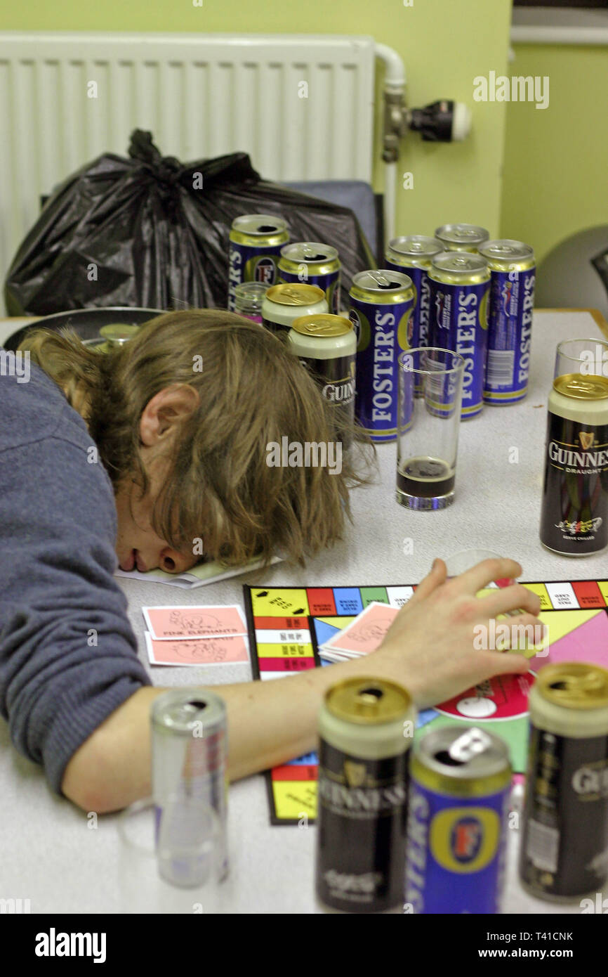 University students playing drinking game. The game involves drinking a ...