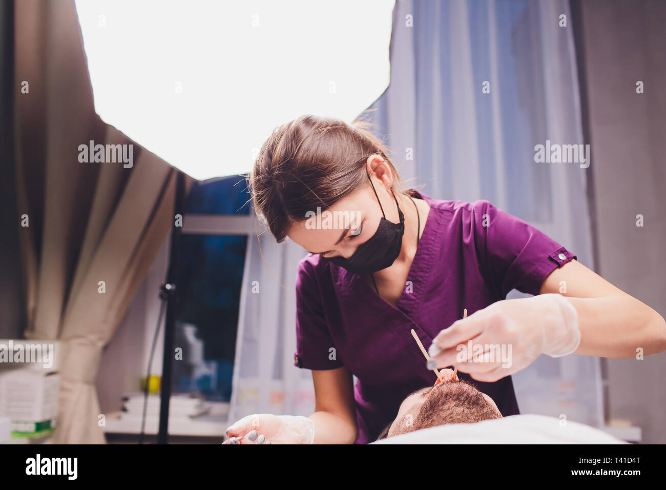 Hair removal. Man's face sugaring epilationsy ellow color, in ...