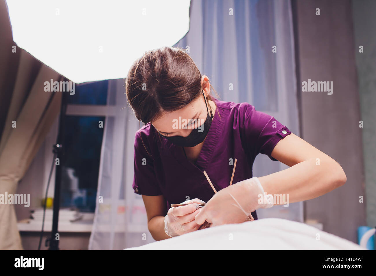 Hair removal. Man's face sugaring epilationsy ellow color, in ...