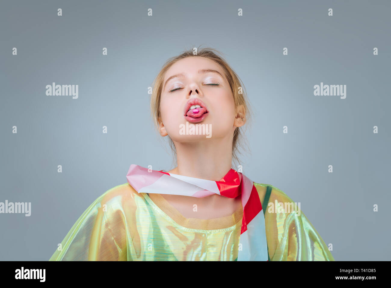 Extravagant model. Young extravagant blonde-haired model posing near ...