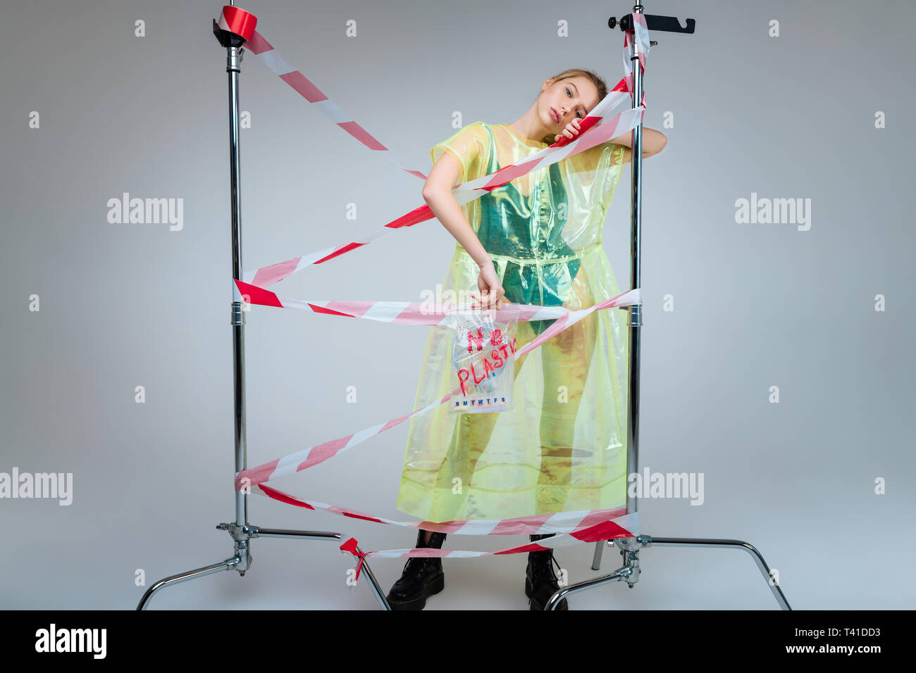 Photoshoot against plastic. Professional young and promising model ...