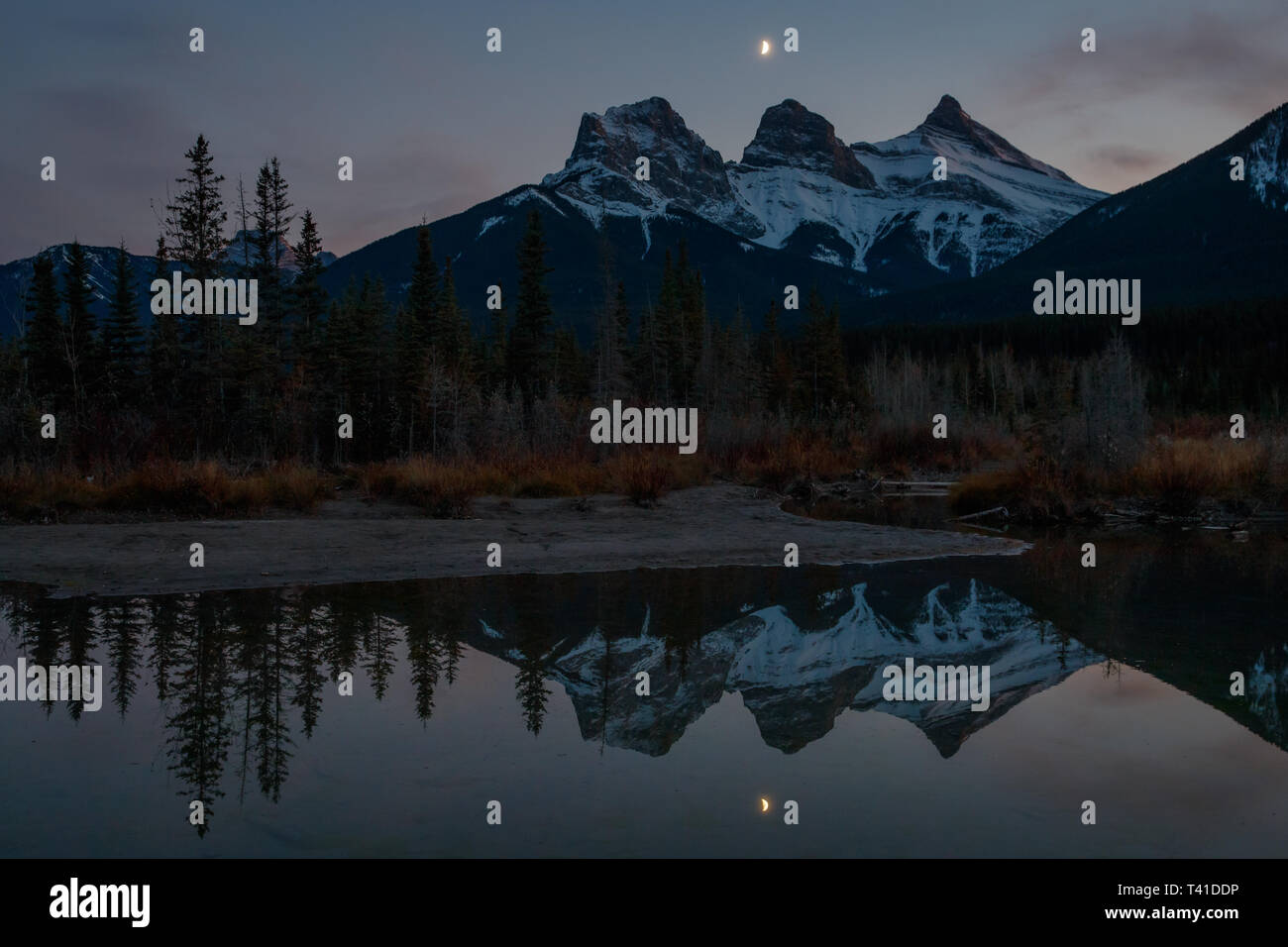 The Three Sisters are a trio of peaks near Canmore, Alberta, Canada ...