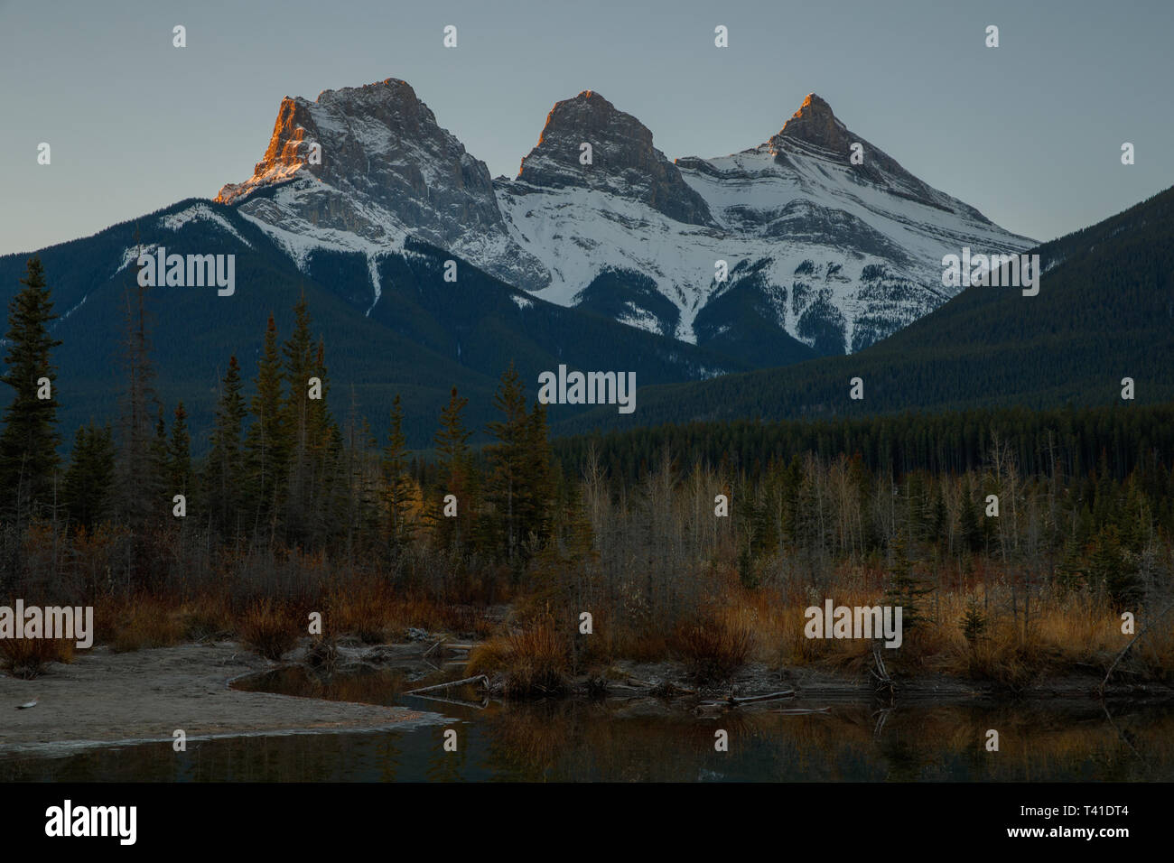 The Three Sisters are a trio of peaks near Canmore, Alberta, Canada ...