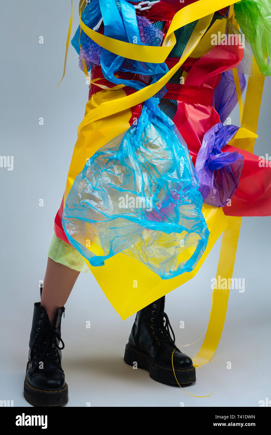 Plastic on body. Close up of female model wearing black leather boots ...