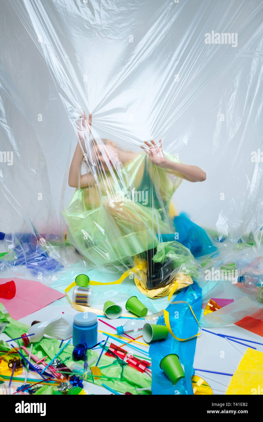 Use less plastic. Responsible young woman encouraging people to use ...