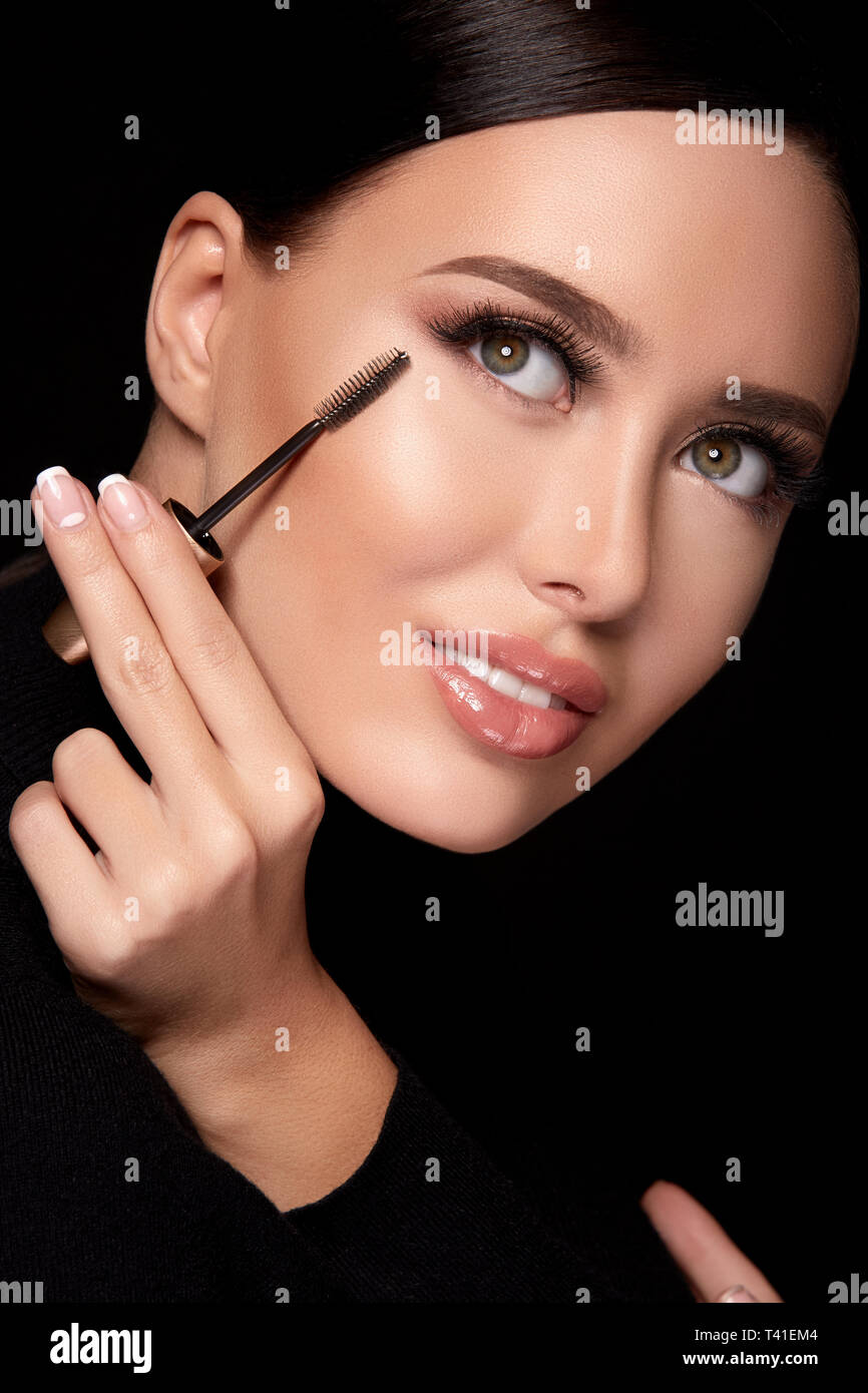 Beautiful girl with mascara Stock Photo - Alamy