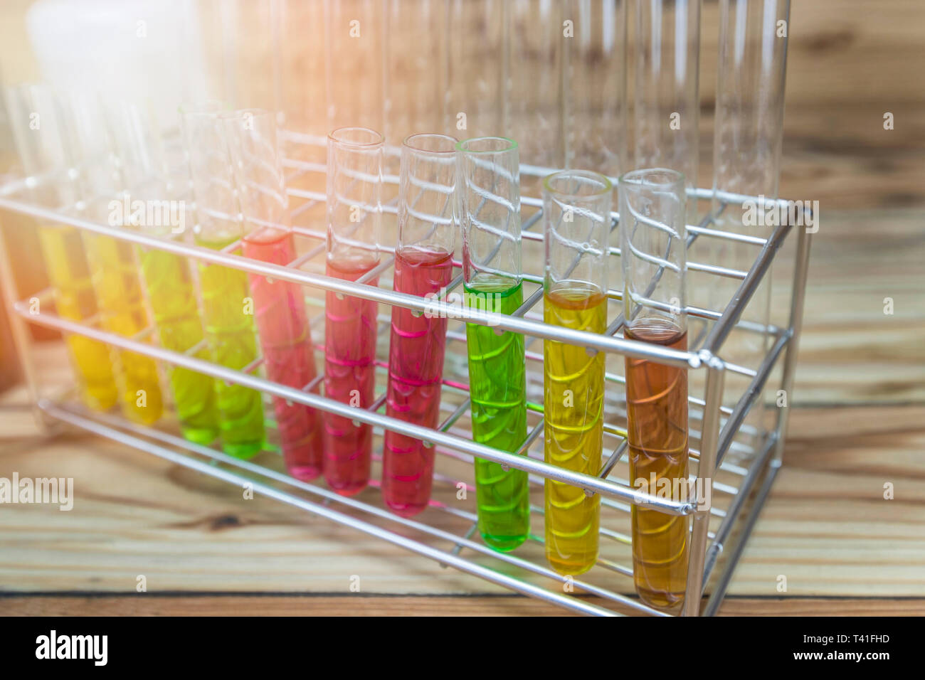 Stand with test tubes in laboratory. Several chemical solution in flask ...