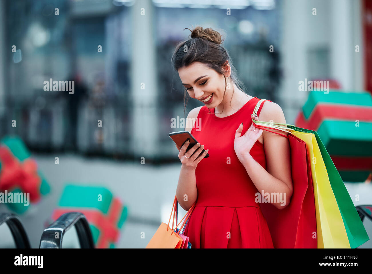 Cute girl posing at shopping mall Stock Photo - Alamy