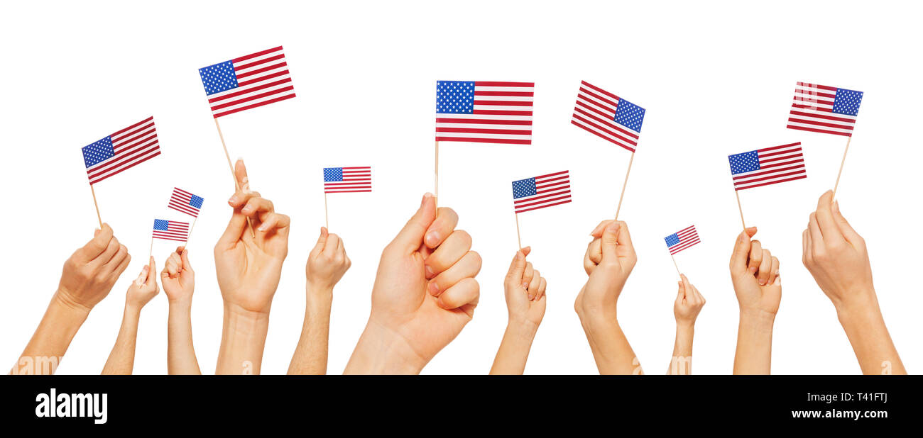 Hands holding and raising small flags of America Stock Photo - Alamy