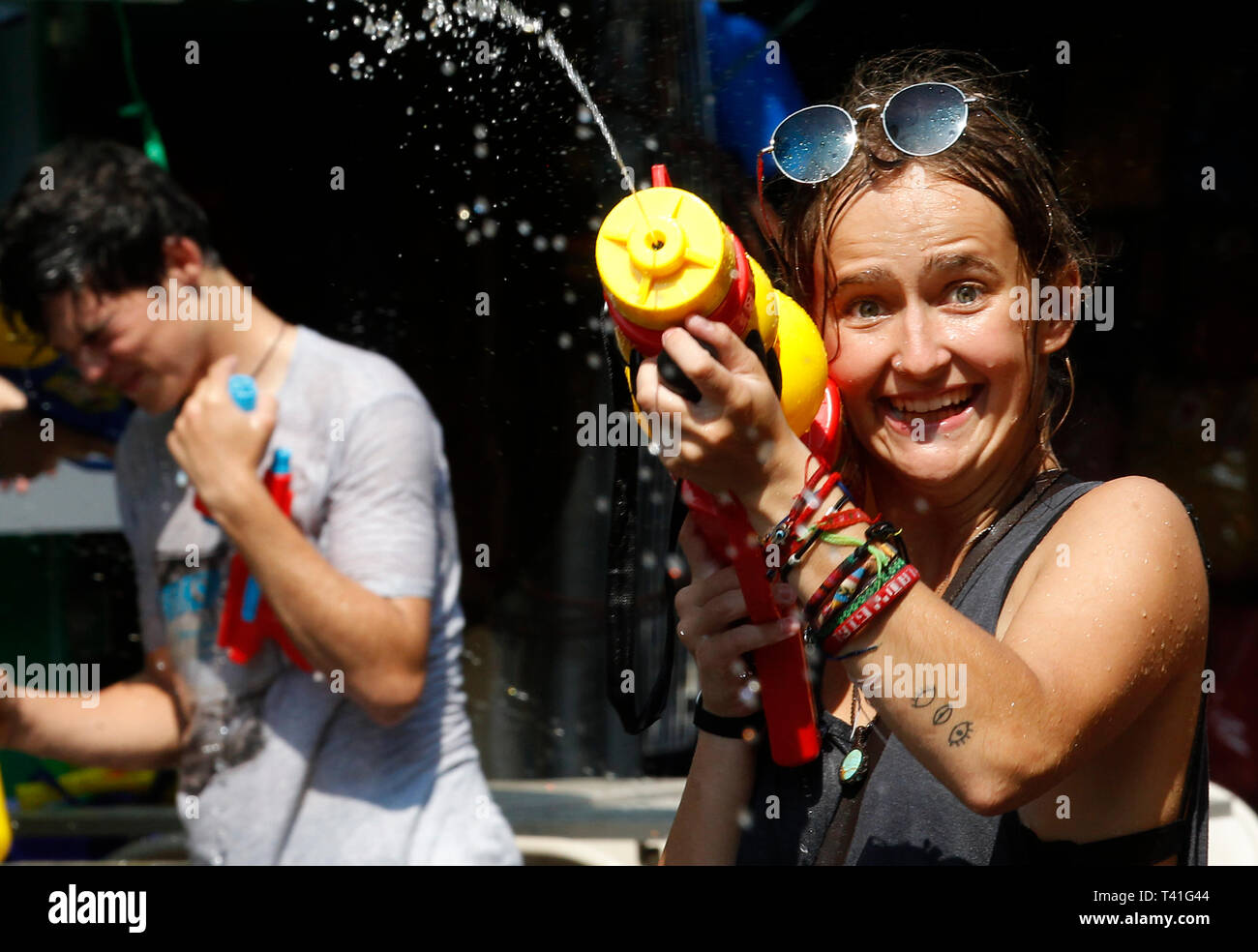A tourist seen using a water gun during the festival. The Songkran ...