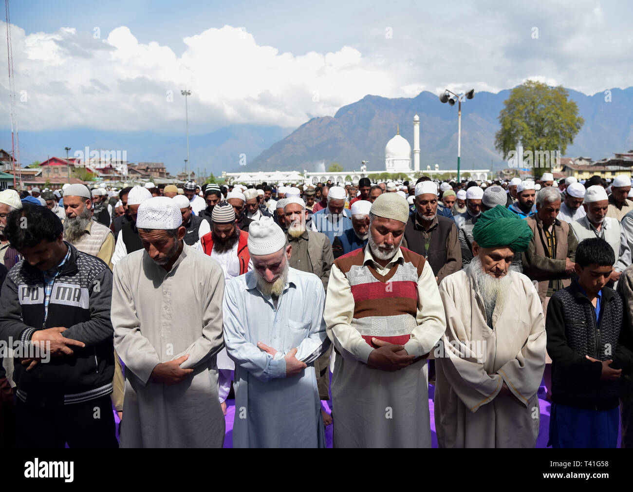 Kashmiri Muslim worshippers seen offering Zuhr prayers during the ...