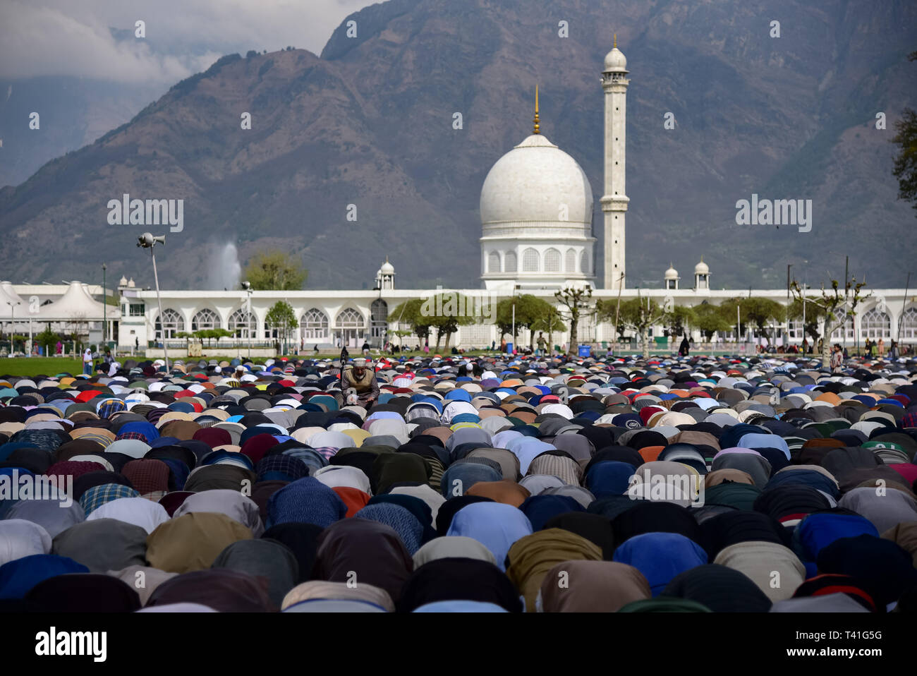 Kashmiri Muslim worshippers seen offering Zuhr prayers during the ...
