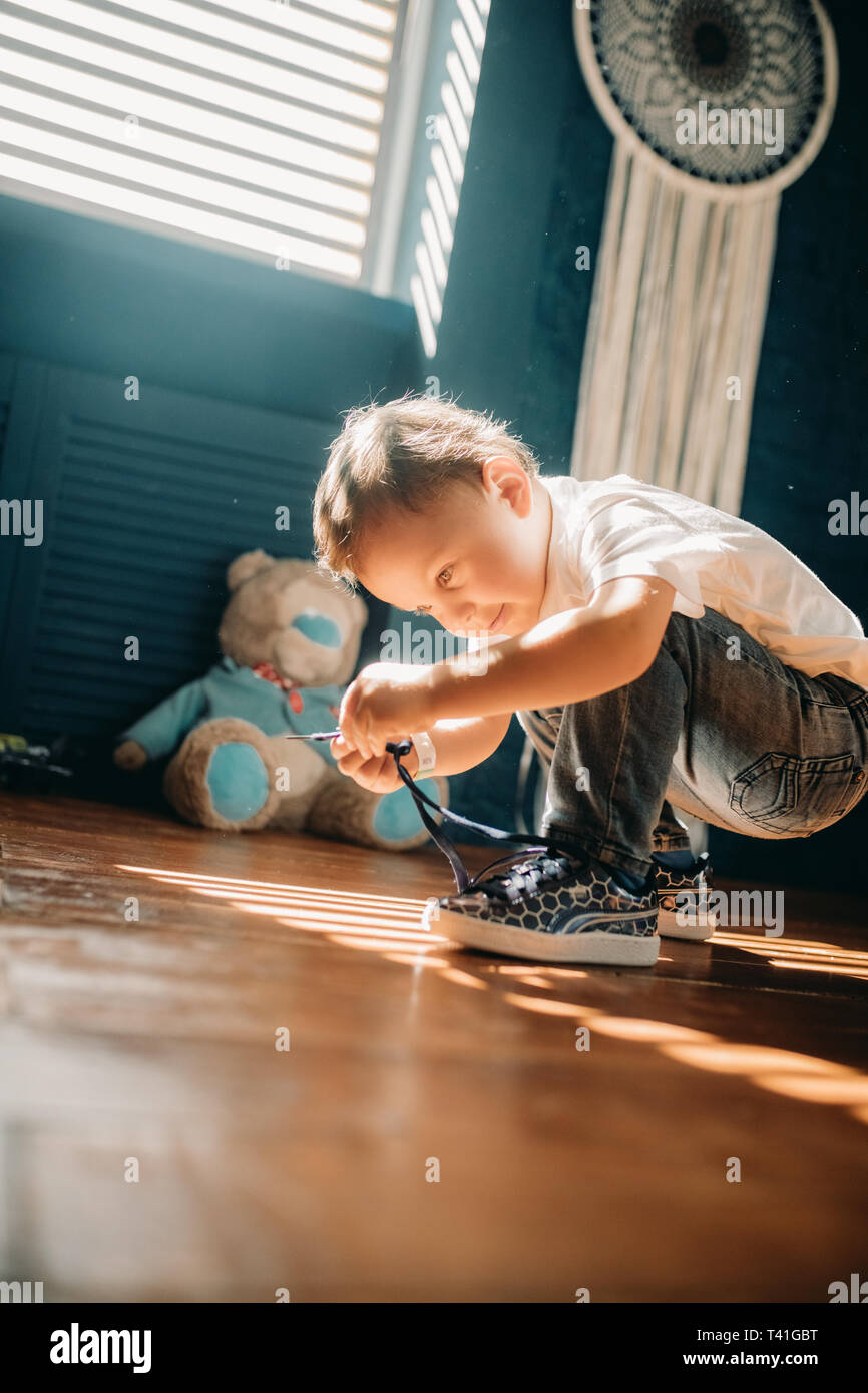 Tying Shoes And Kid High Resolution Stock Photography and Images - Alamy