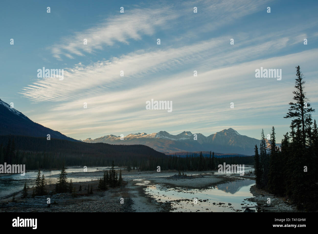 Mountain Ranges at sunset with the Athabasca River in Jasper National ...