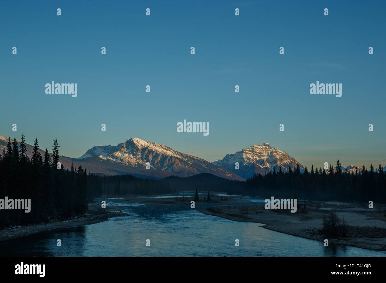 Mountain Ranges at sunset with the Athabasca River in Jasper National ...
