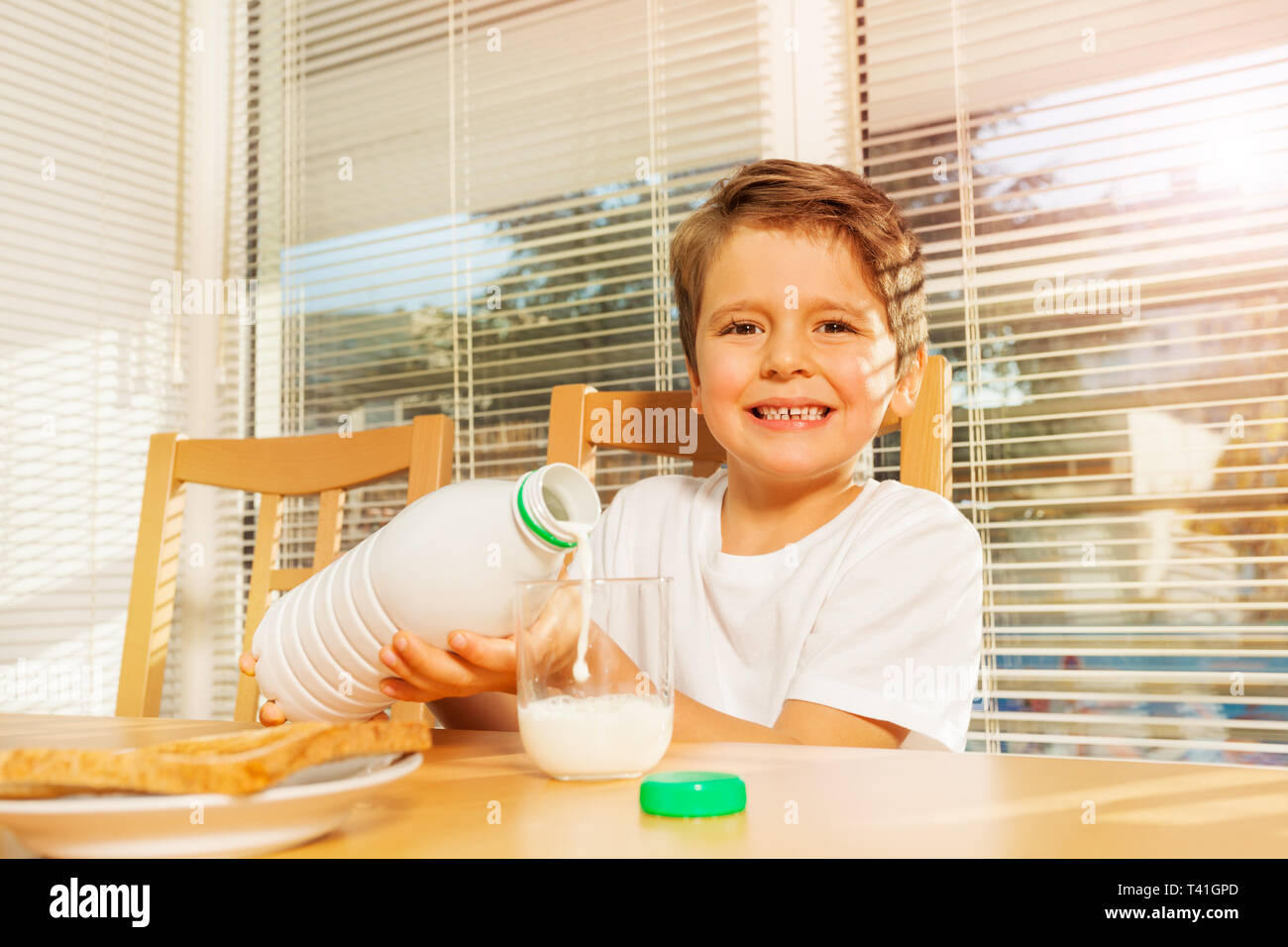 Kid pouring milk hi-res stock photography and images - Alamy