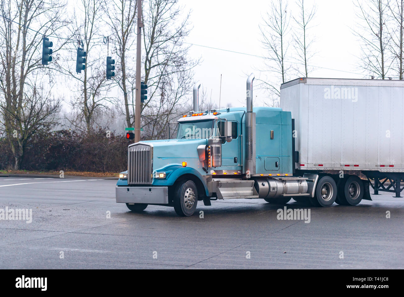 Tractor trailer turning on headlights hi-res stock photography and ...