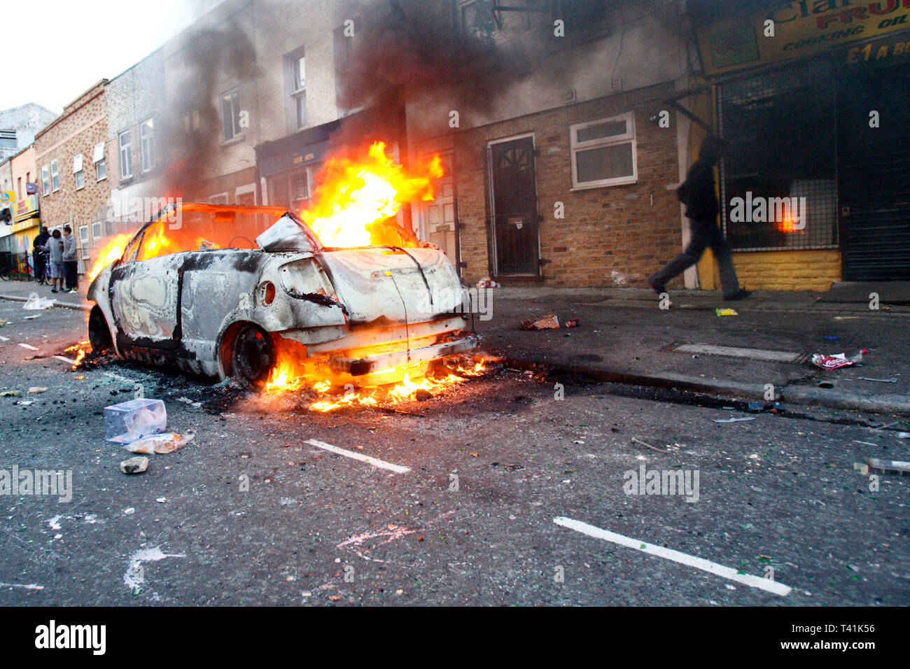 A Citroen car burns on fire in Hackney during rioting. Pembury Estate ...