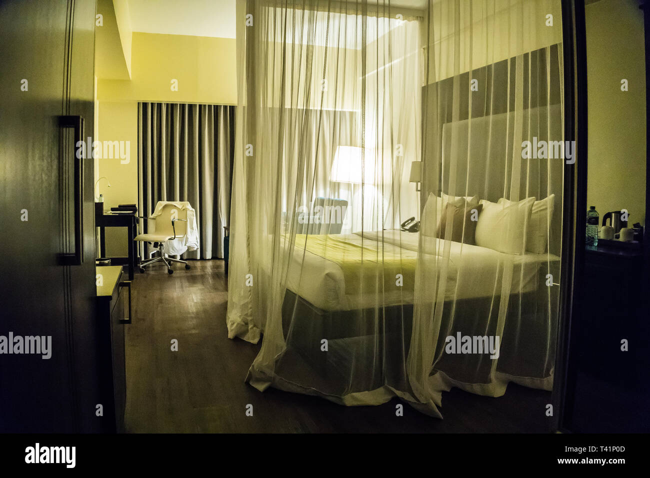 Mosquito netting over a bed in tourist resort in Africa Stock Photo - Alamy