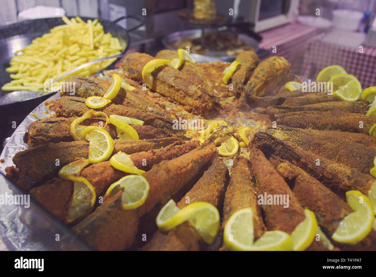 Fried Fish with Lemon at Town Fair Food Stall Stock Photo - Alamy