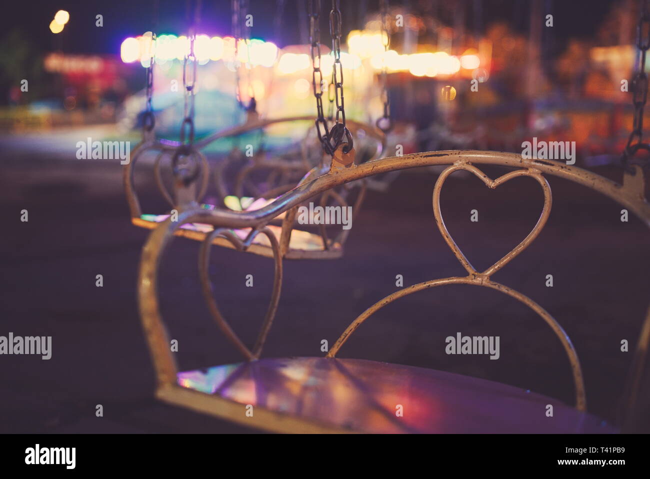 Chain Carousel Closeup with Town Fair Lights at Night Stock Photo - Alamy