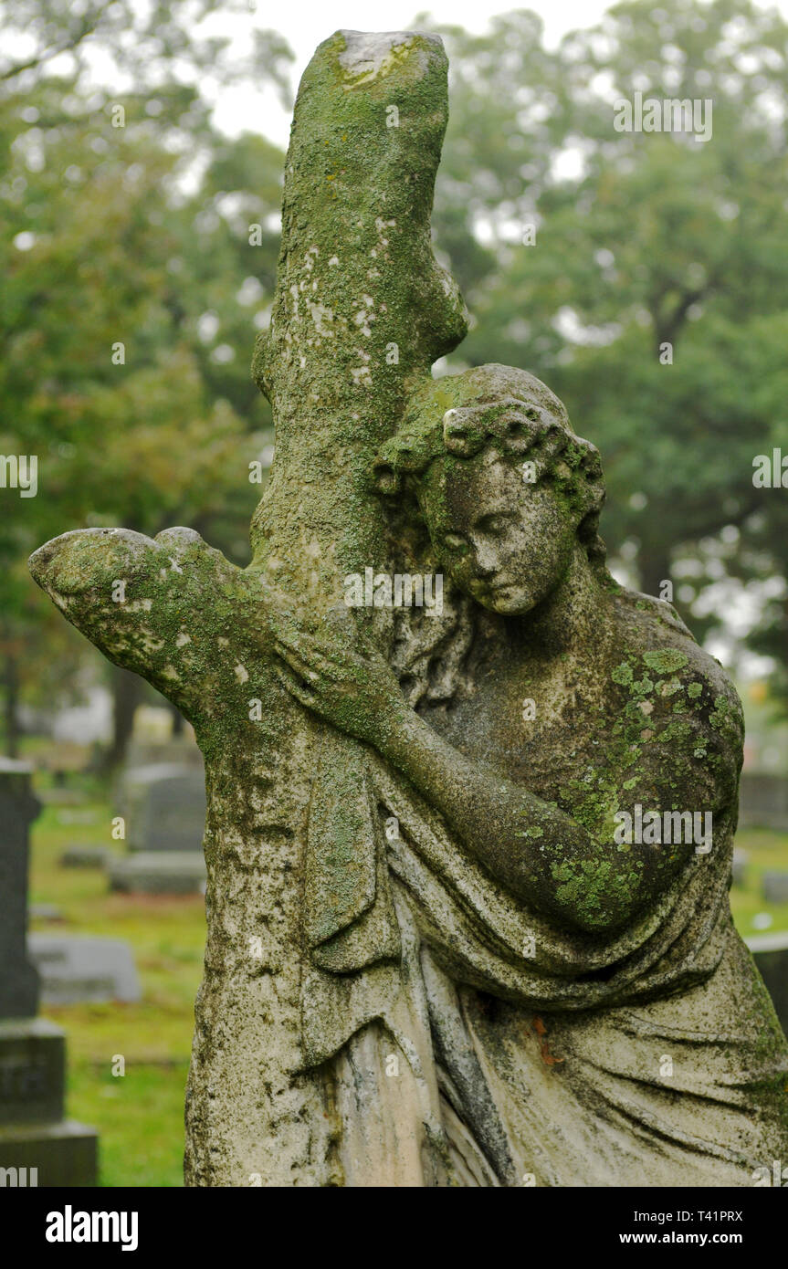 Detail of a moss-covered sculpture marking a grave at the historic ...