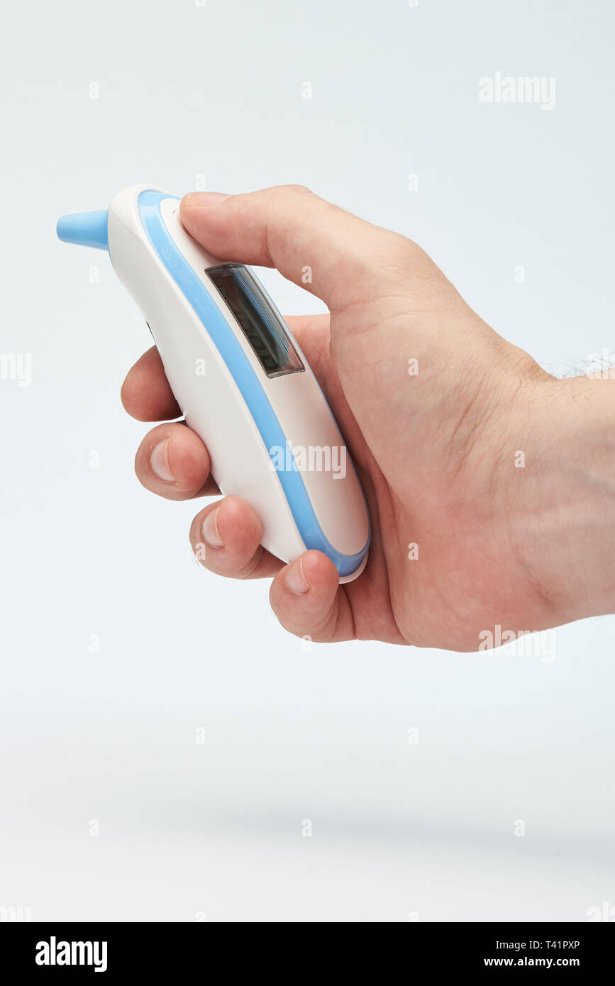 Hand with digital thermometer isolated on white background Stock Photo ...