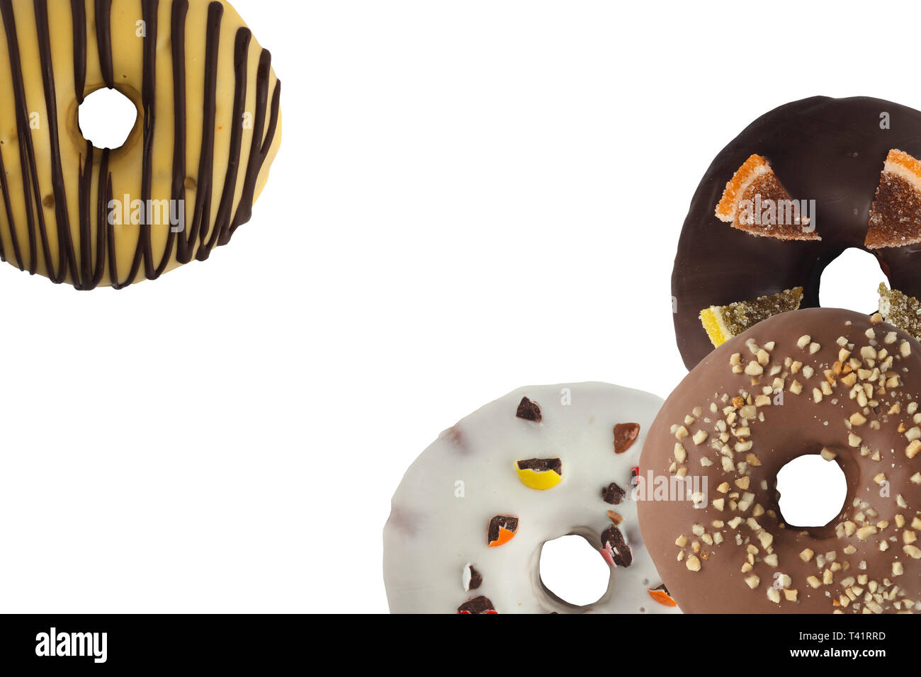 Different bright tasty donuts on a white background. Place under the ...