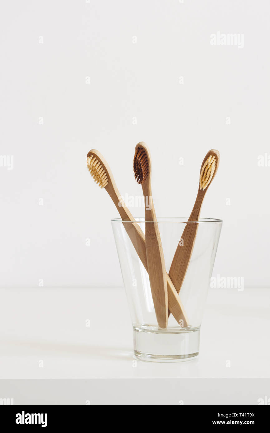 Bamboo toothbrushes with natural bristles in glass in Scandinavian ...